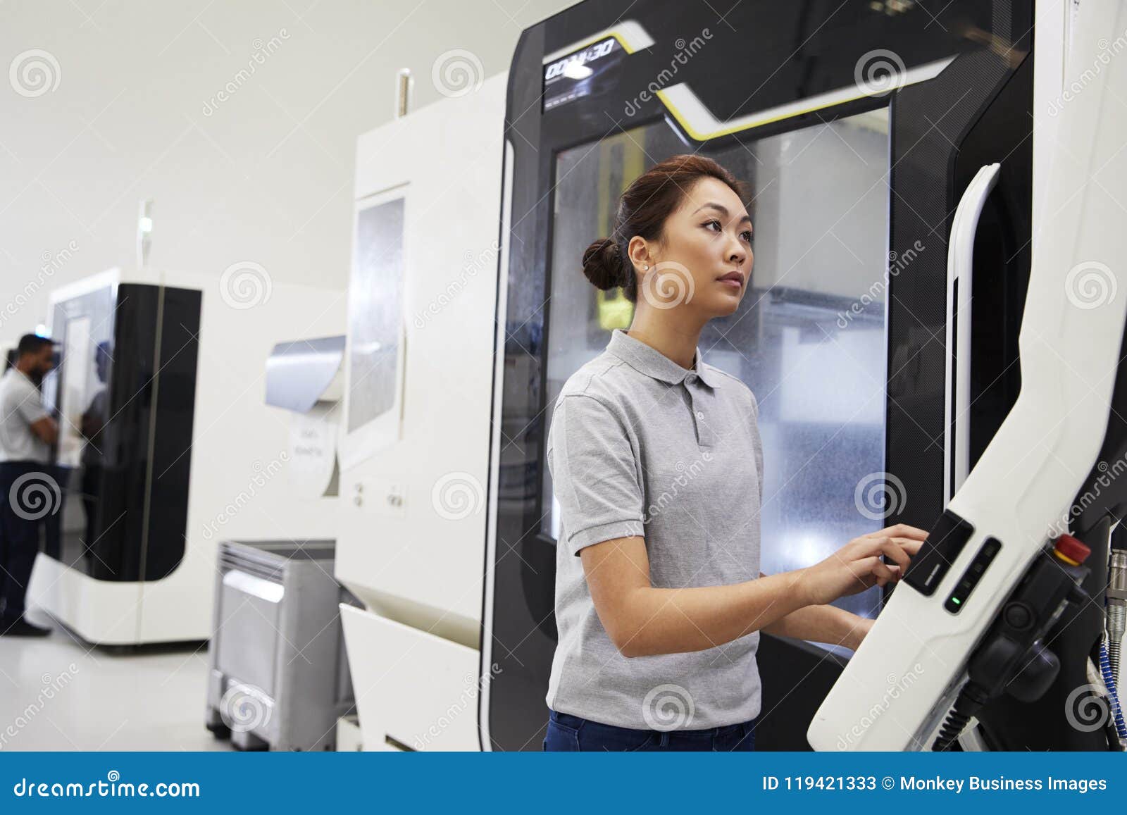 Female Engineer Operating CNC Machinery in Factory Stock Image - Image ...