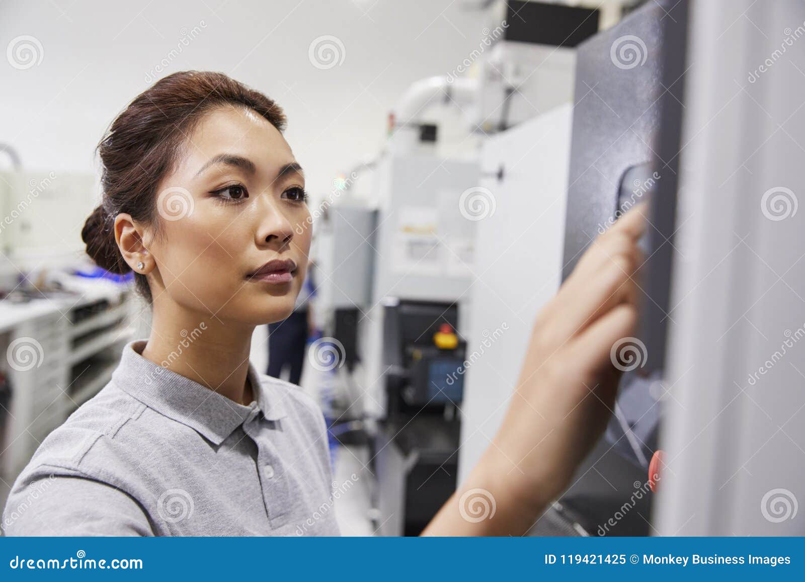 Female Engineer Operating CNC Machinery in Factory Stock Image - Image ...
