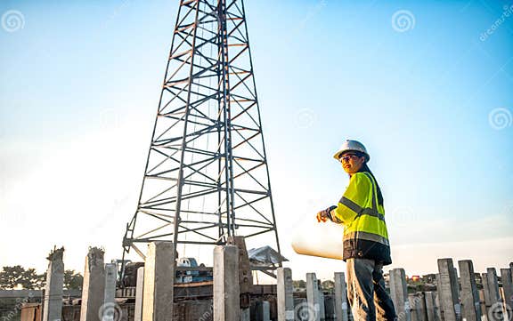 A Female Engineer is Standing and Inspecting the Progress of the Pillar ...