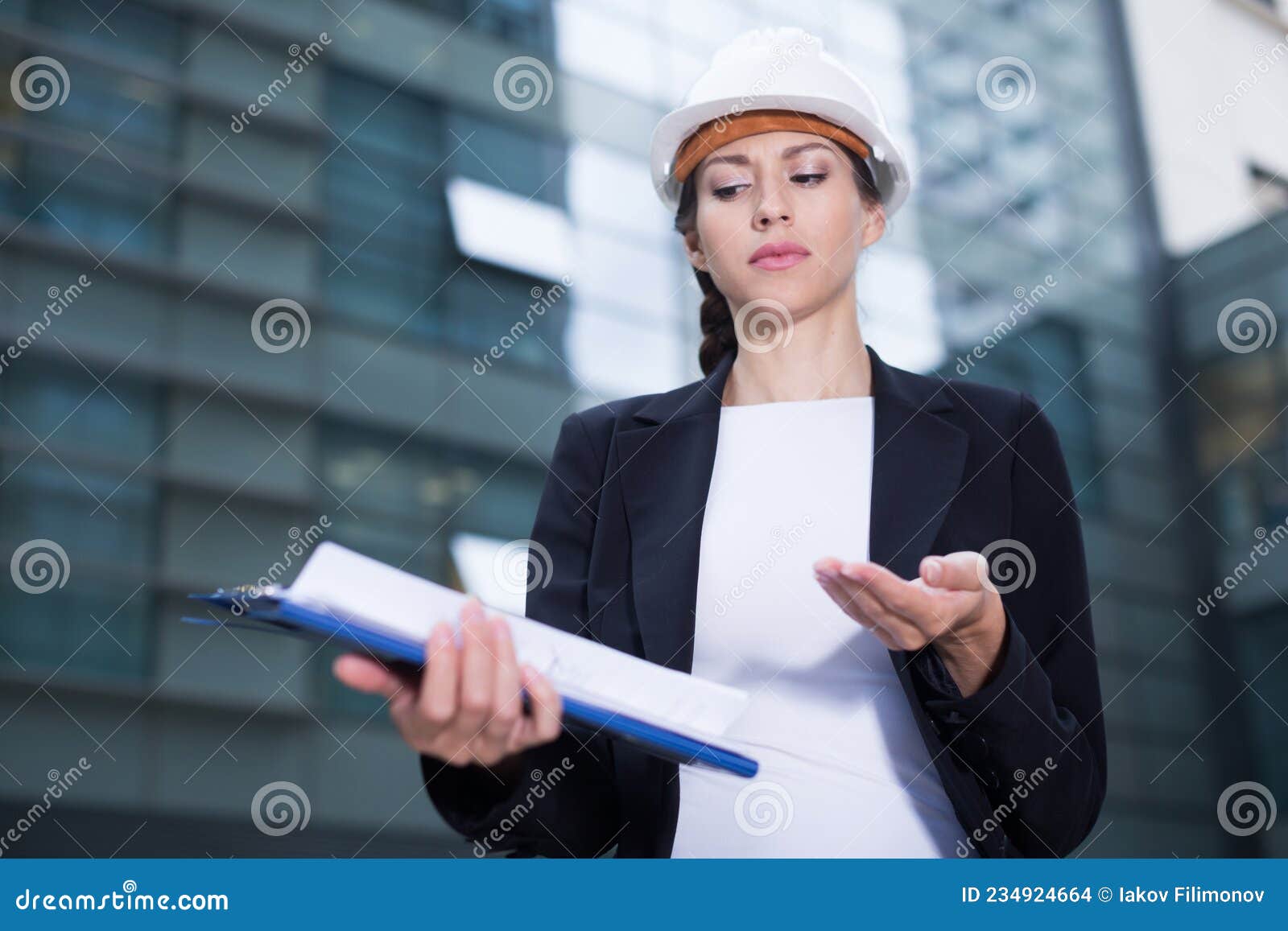 Female Engineer in Suit and Hat with Folder is Dissatisfieded of ...