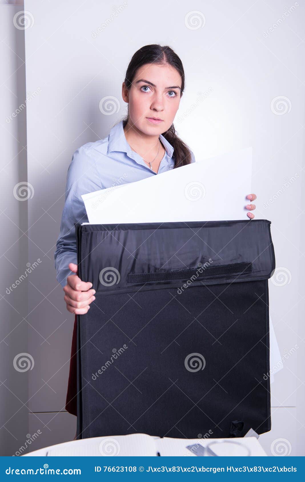 Female Engineer is Taking Drawings Out of a Big Folder Stock Photo ...