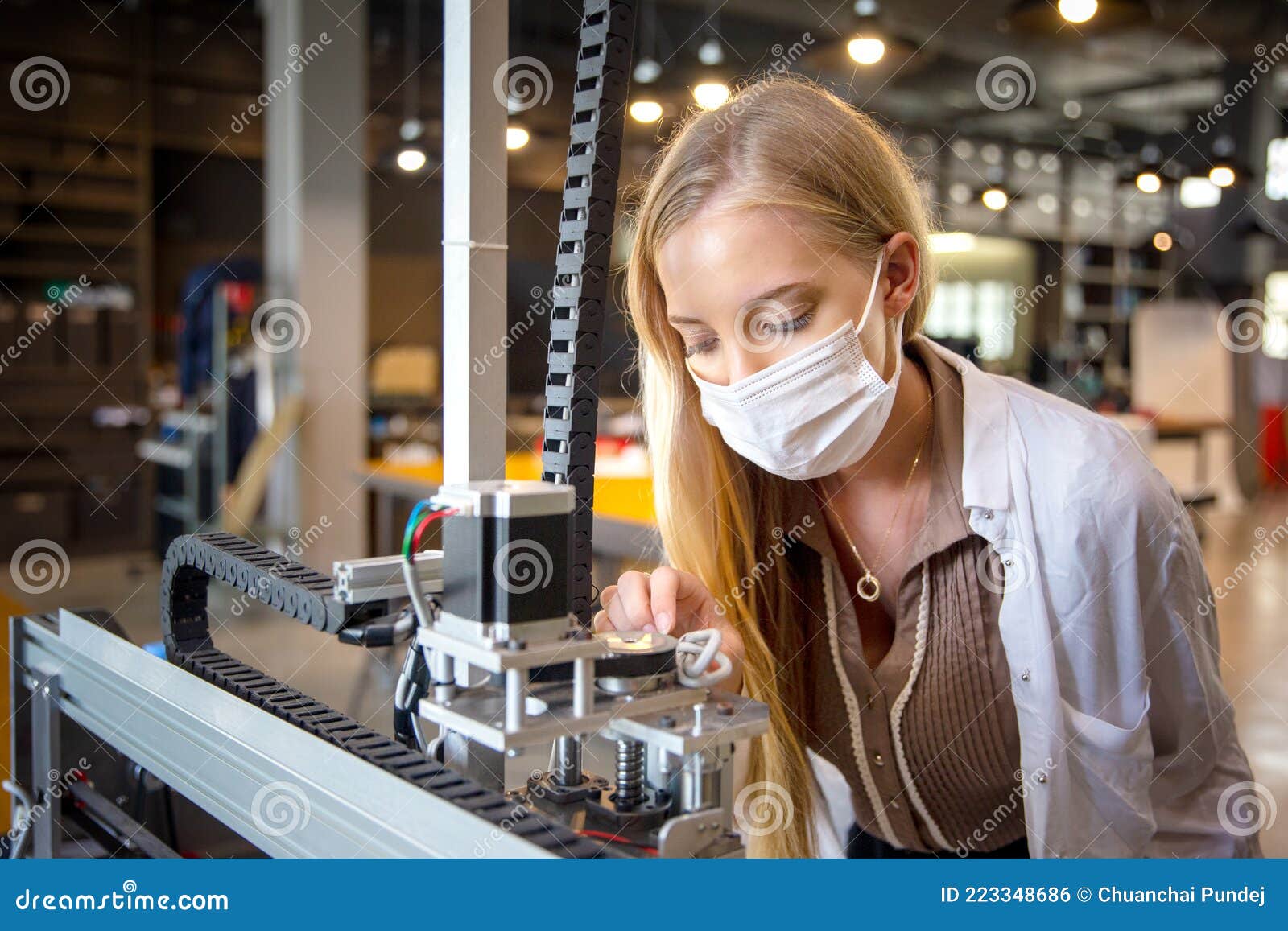 Female Engineer or Technician is Working, Examining or Repairing ...
