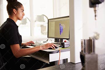 Female Engineer Using CAD System To Work on Component Stock Photo ...