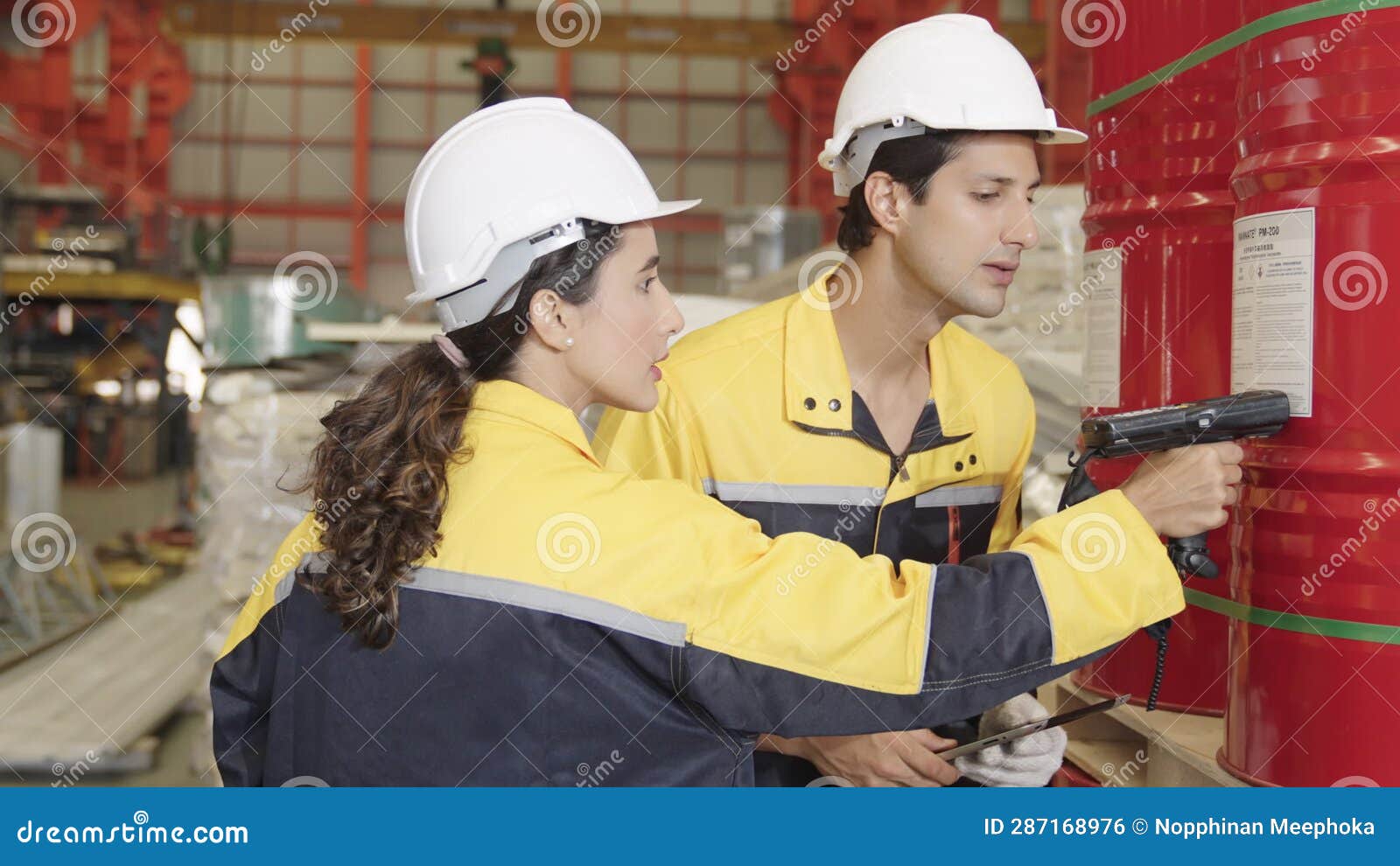 Female Engineer Utilizes a Barcode Scanner on Industrial Products Stock ...