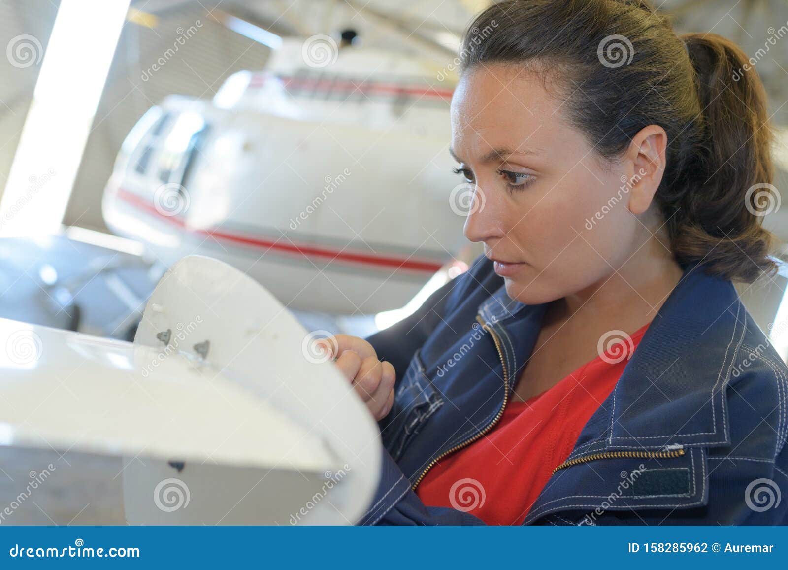 Female Engineer Working on Aircraft Component Stock Photo - Image of ...