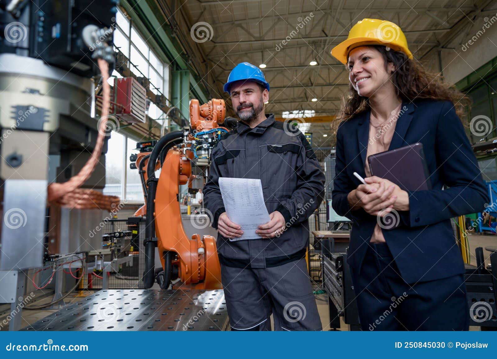 Female Engineering Manager and Mechanic Worker Doing Routine Check Up ...