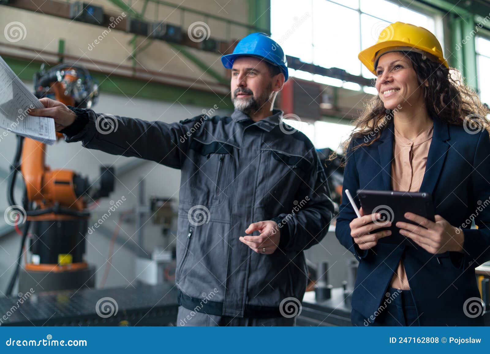 Female Engineering Manager and Mechanic Worker Doing Routine Check Up ...