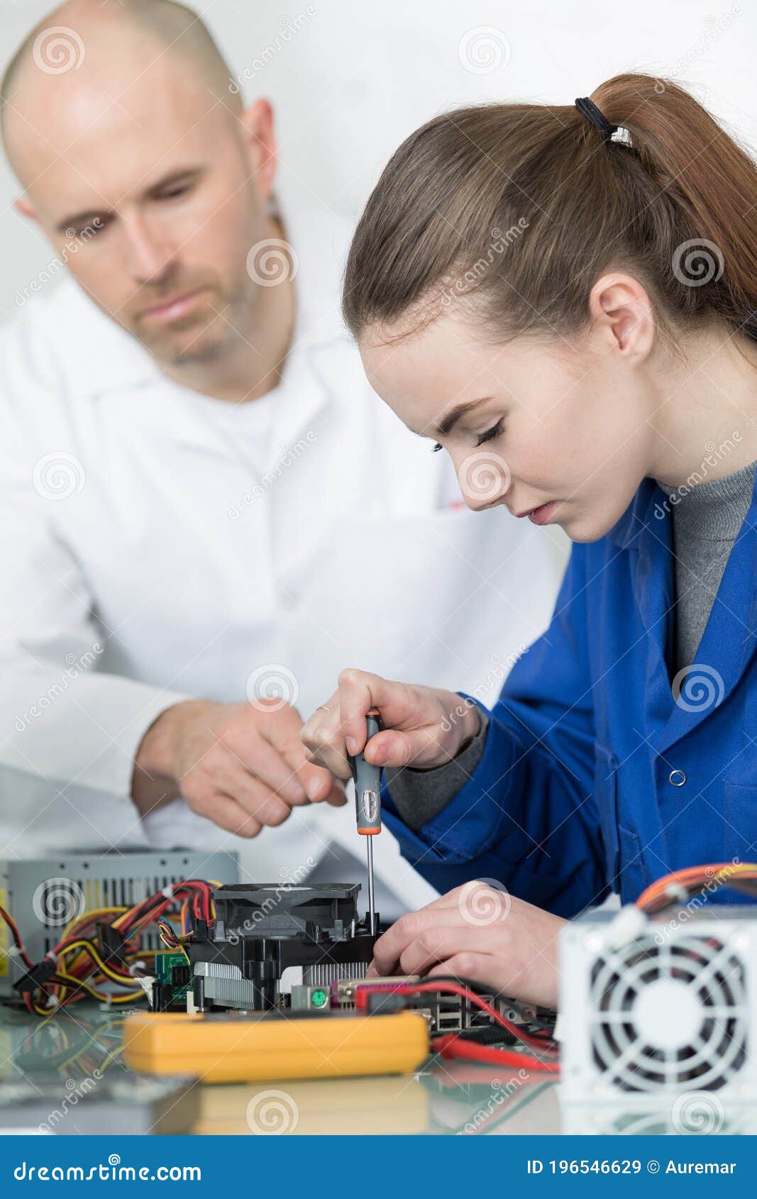 Female Engineering Student Making Connections for Electronics ...