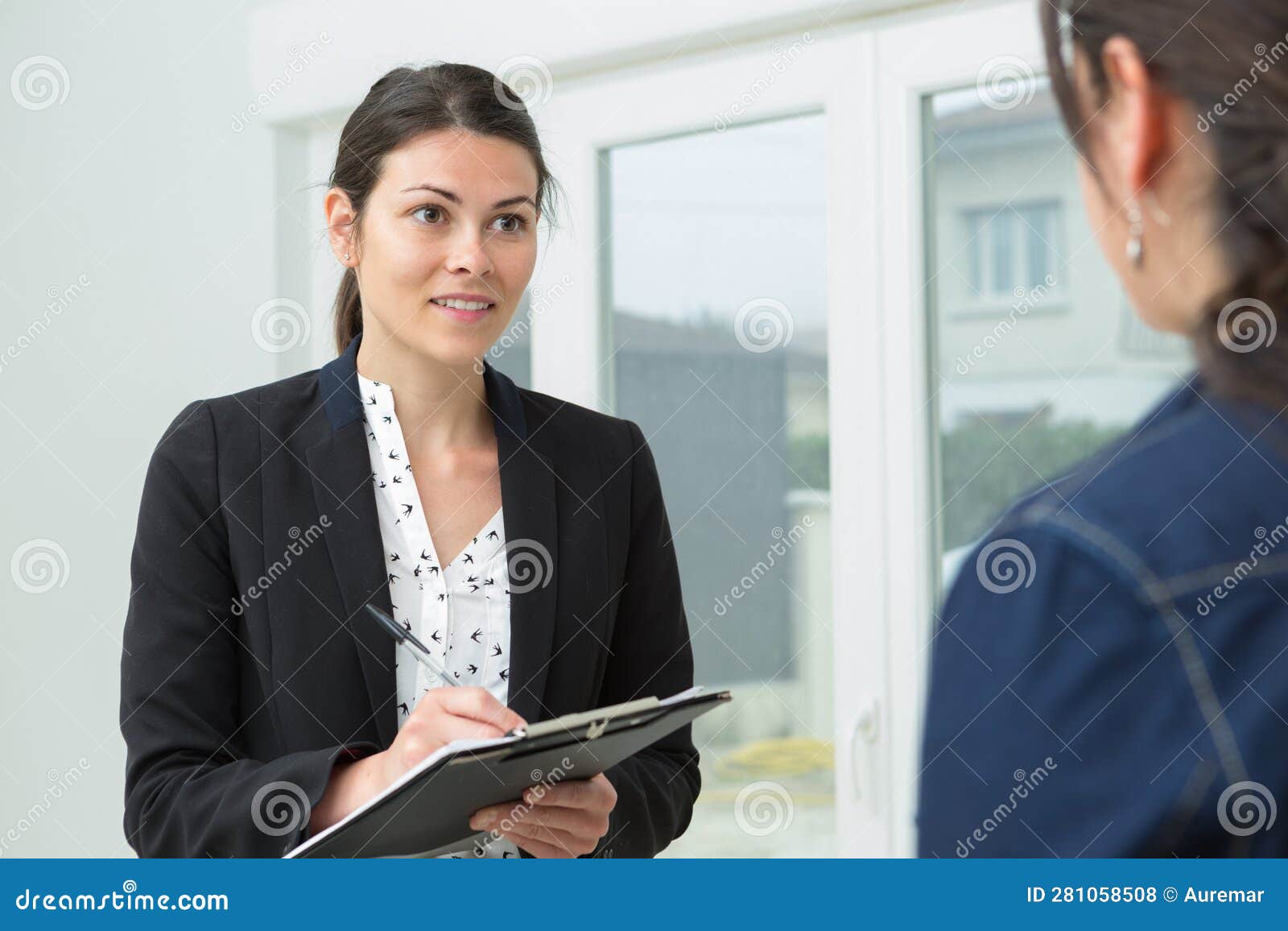 Female Estate Agent in Conversation with Client Stock Photo - Image of ...