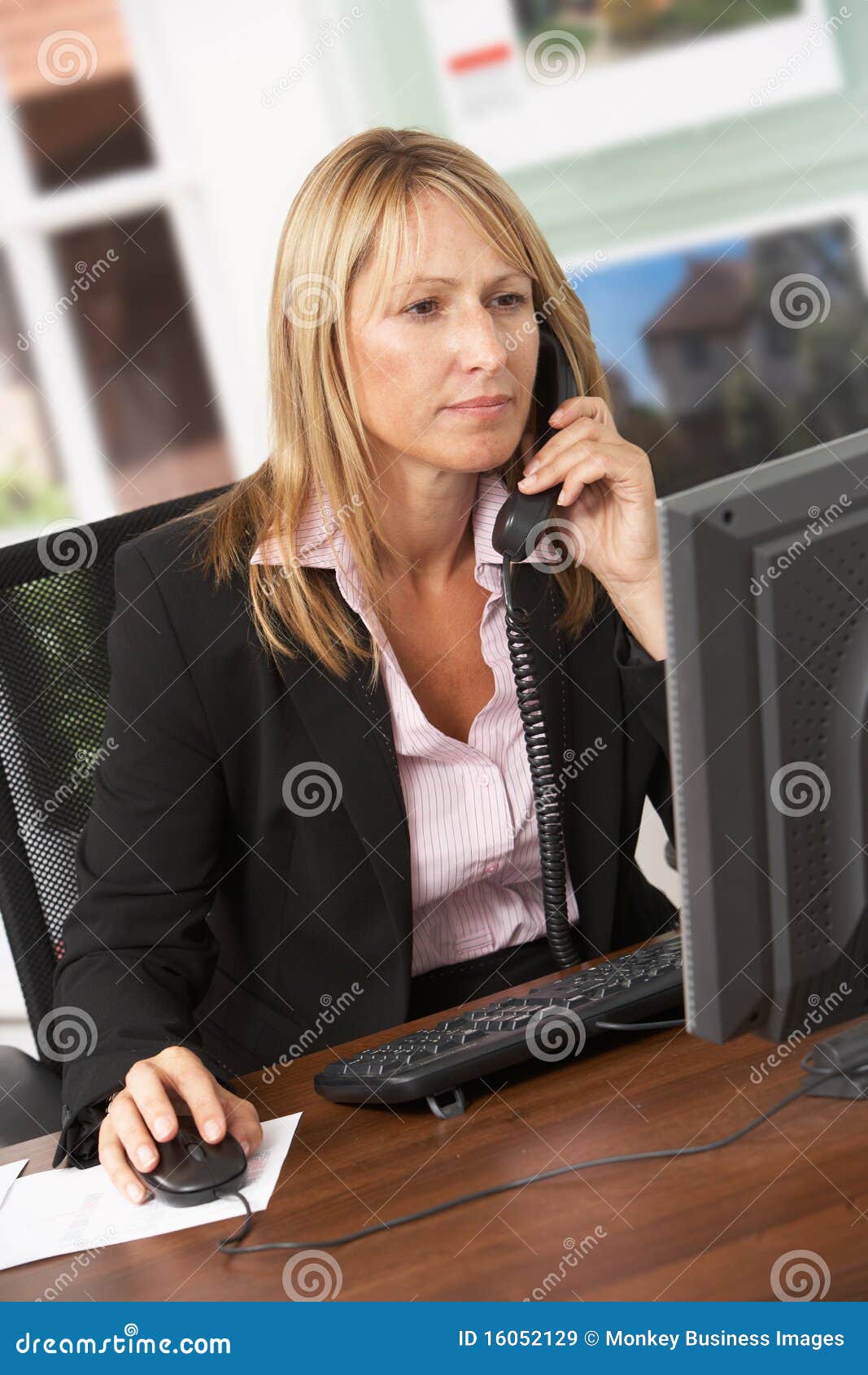 Female Estate Agent Talking on Phone at Desk Stock Image - Image of ...