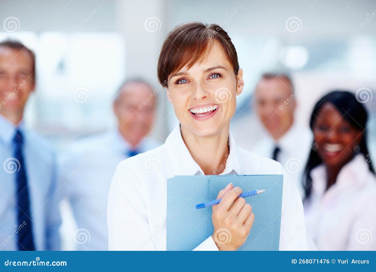 Female Executive Laughing. Female Executive Laughing with Colleagues in ...