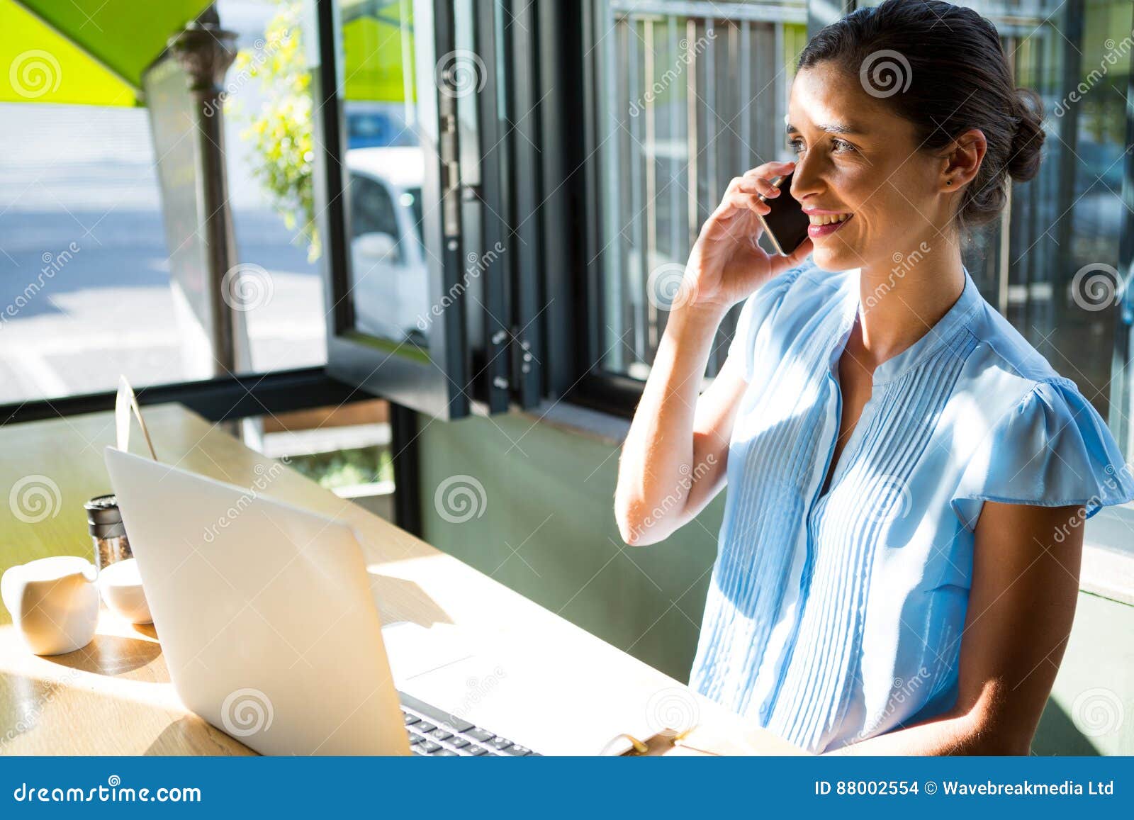 Female Executive Talking on Mobile Phone in CafÃƒÂ© Stock Photo - Image ...
