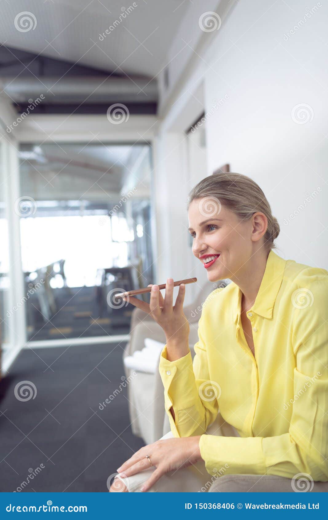Female Executive Talking on Mobile Phone in Office Stock Photo - Image ...