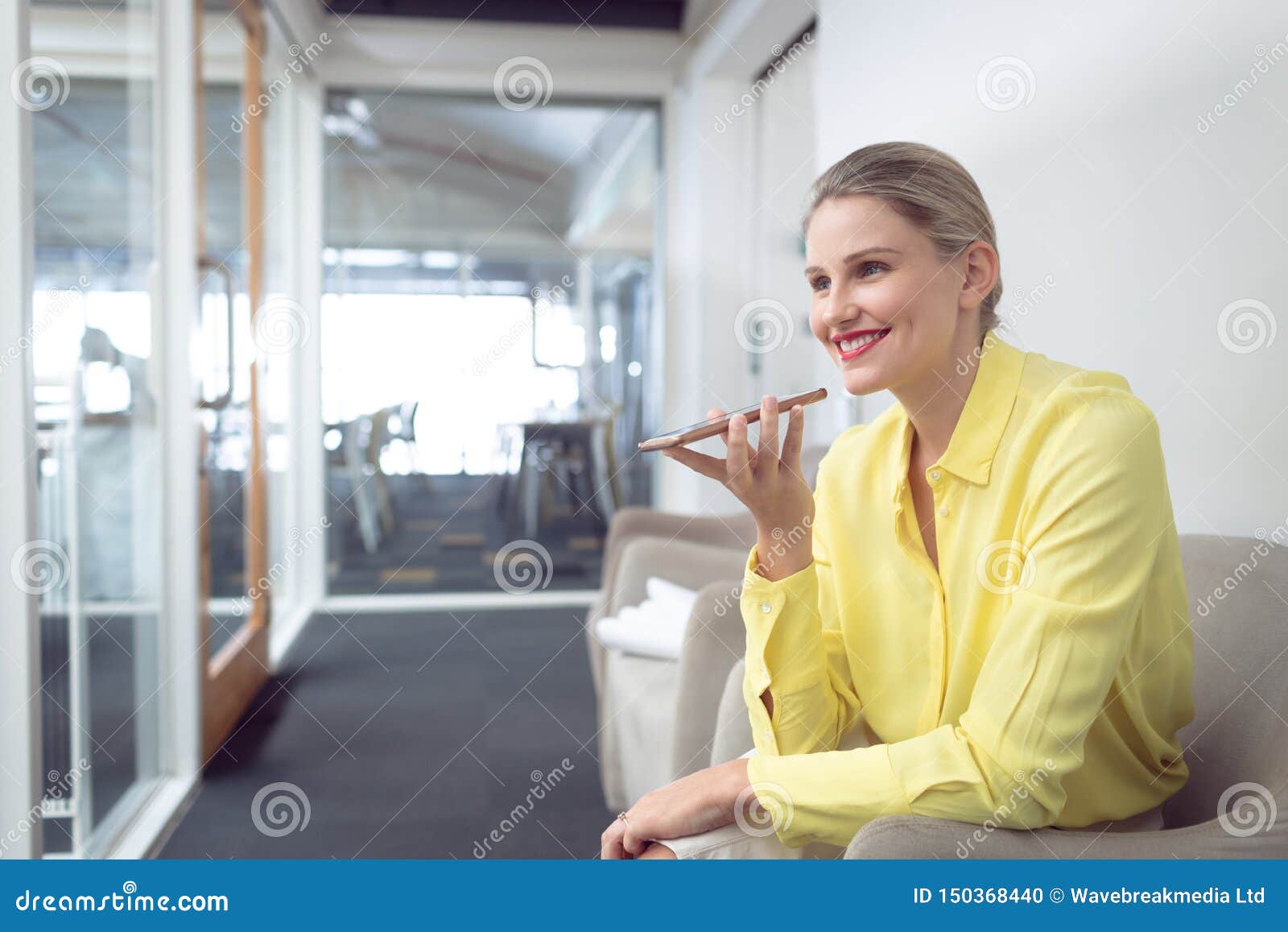 Female Executive Talking on Mobile Phone in Office Stock Photo - Image ...