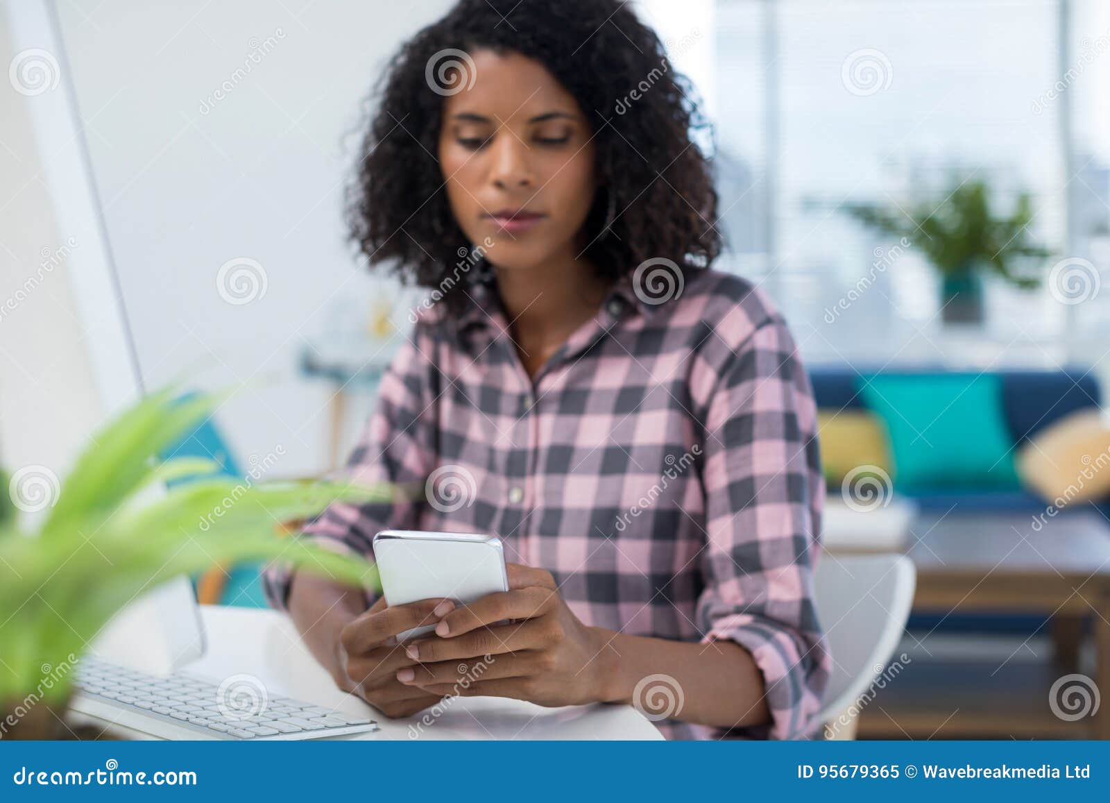 Female Executive Using Mobile Phone at Desk Stock Image - Image of ...