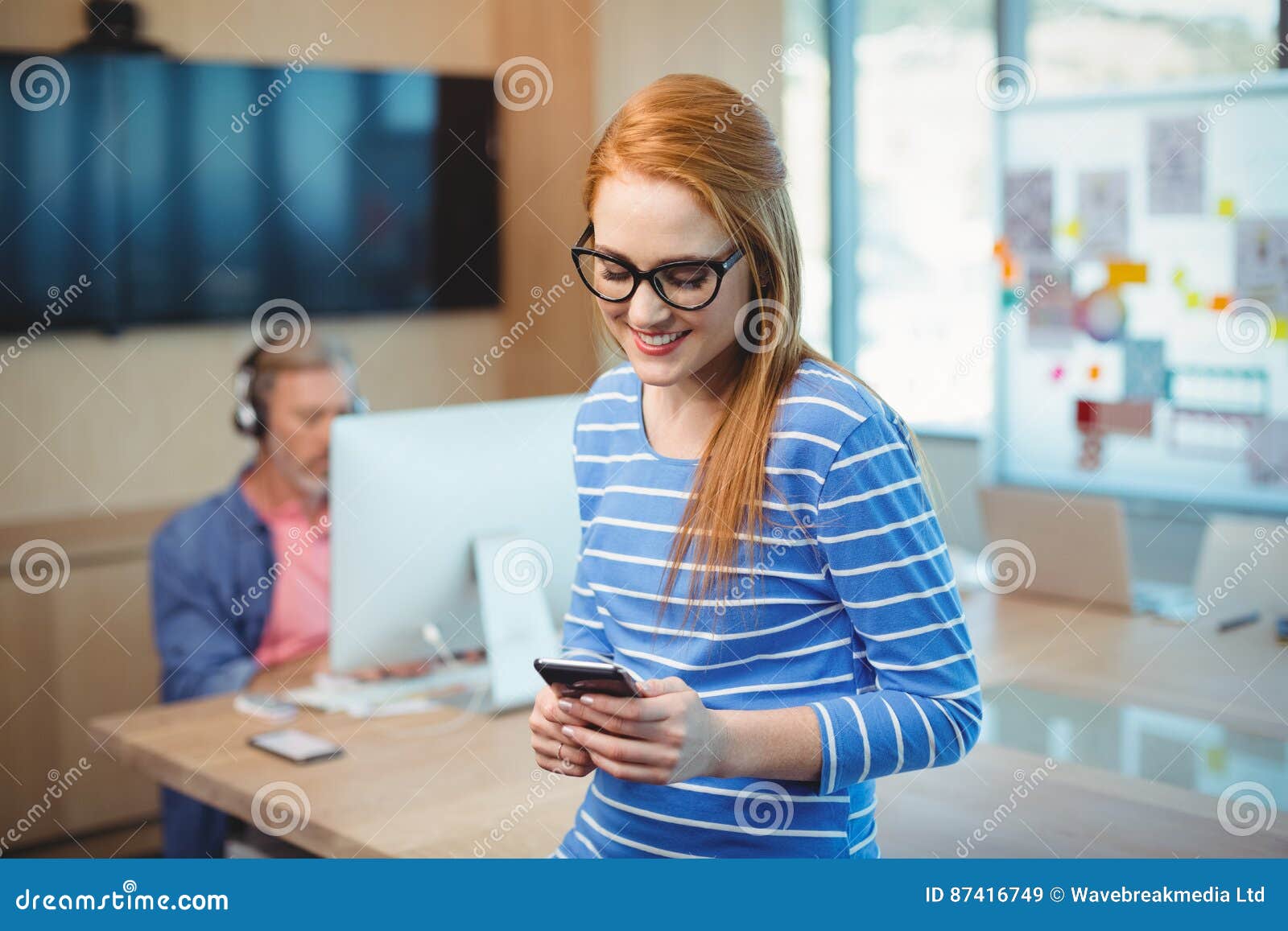 Female Executive Using Mobile Phone in Office Stock Image - Image of ...