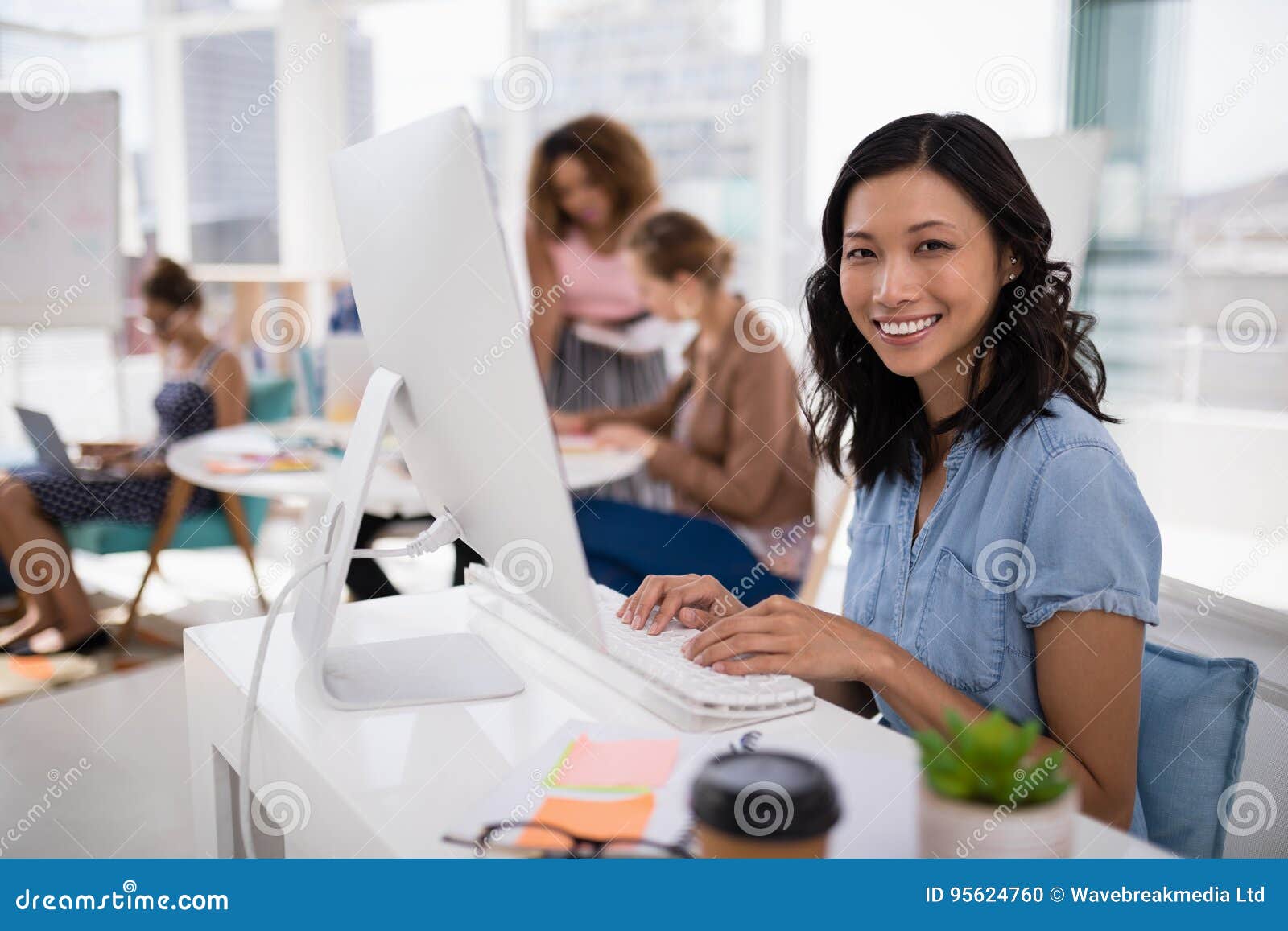 Female Executive Working on Computer at Desk in the Office Stock Photo ...
