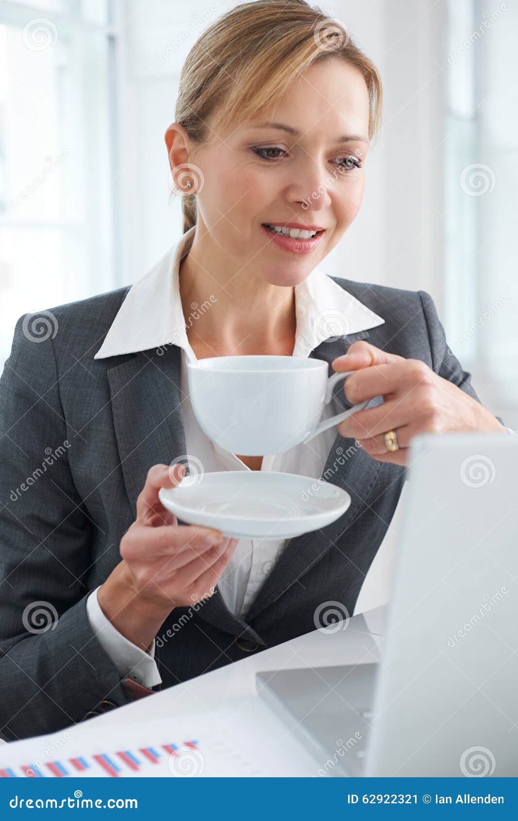 Female Executive Working at Desk with Hot Drink Stock Image - Image of ...