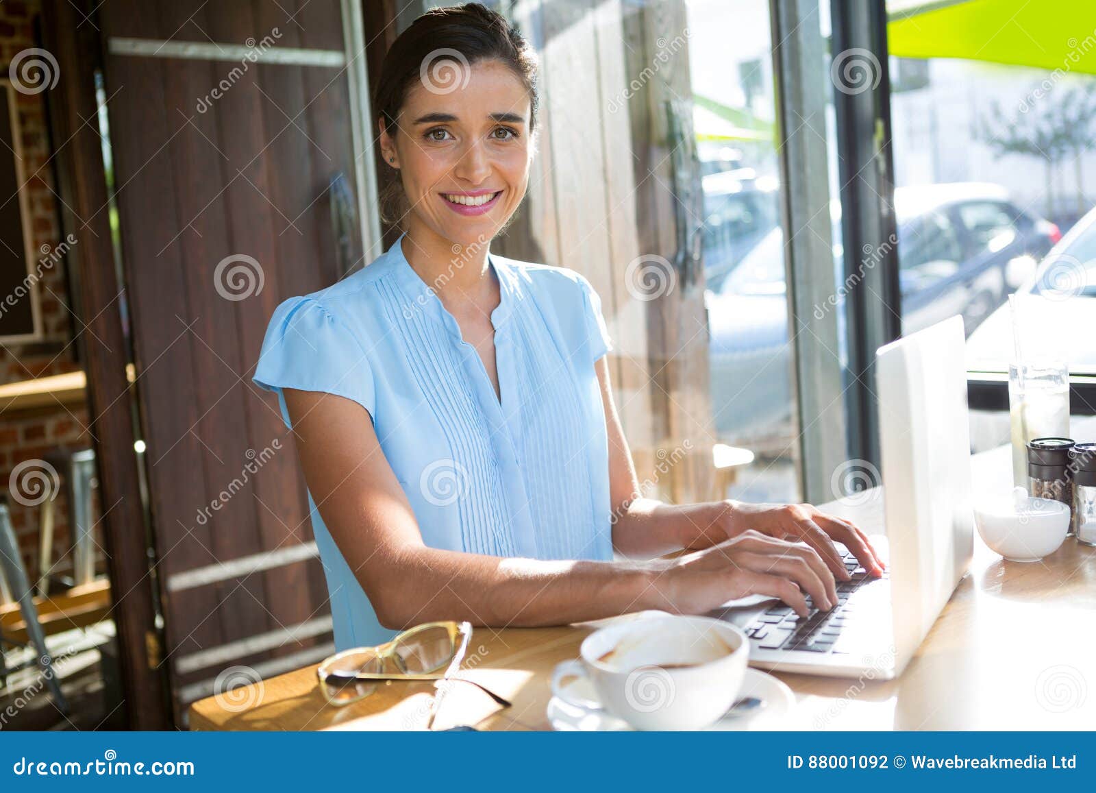 Female Executive Working on Laptop in CafÃƒÂ© Stock Photo - Image of ...