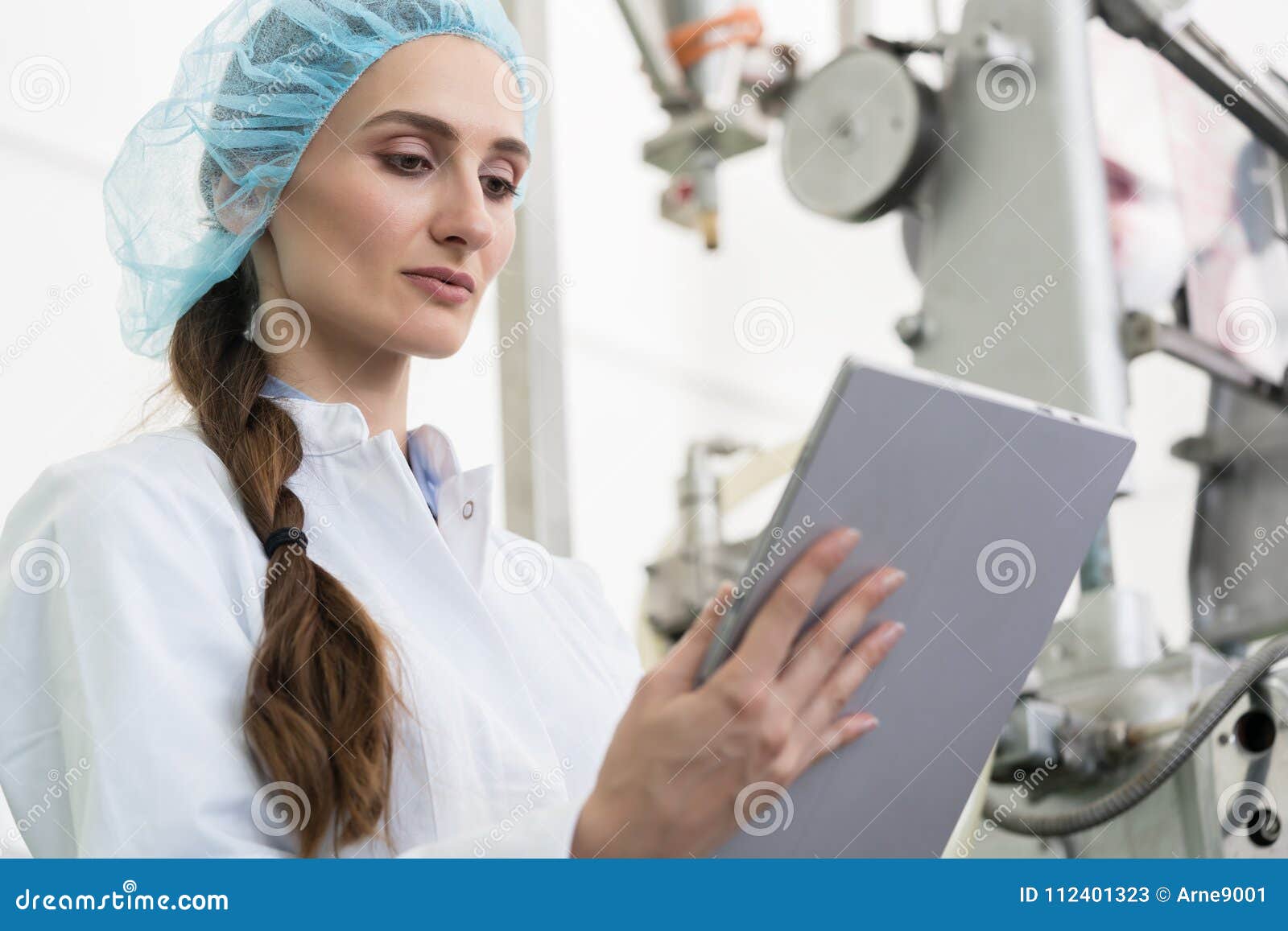 Woman Expert Analyzing Information on Tablet during Work in ...