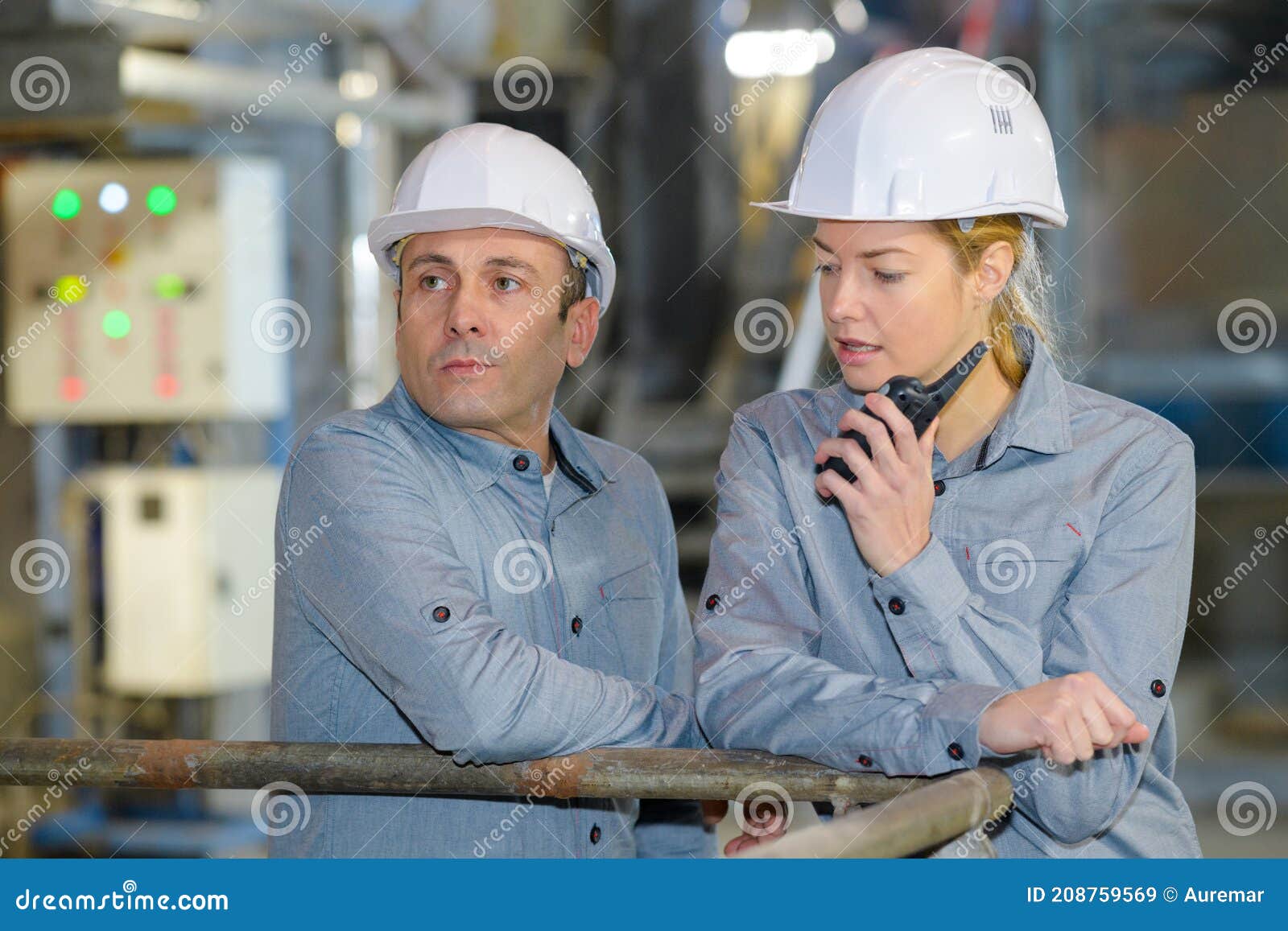 Female Factory Supervisor Giving Signal Using Electronic Device Stock ...