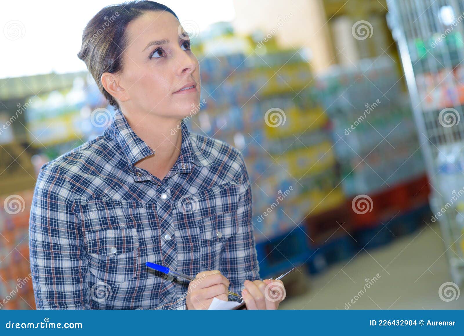 Female Factory Worker Writing on Clipboard Stock Photo - Image of ...