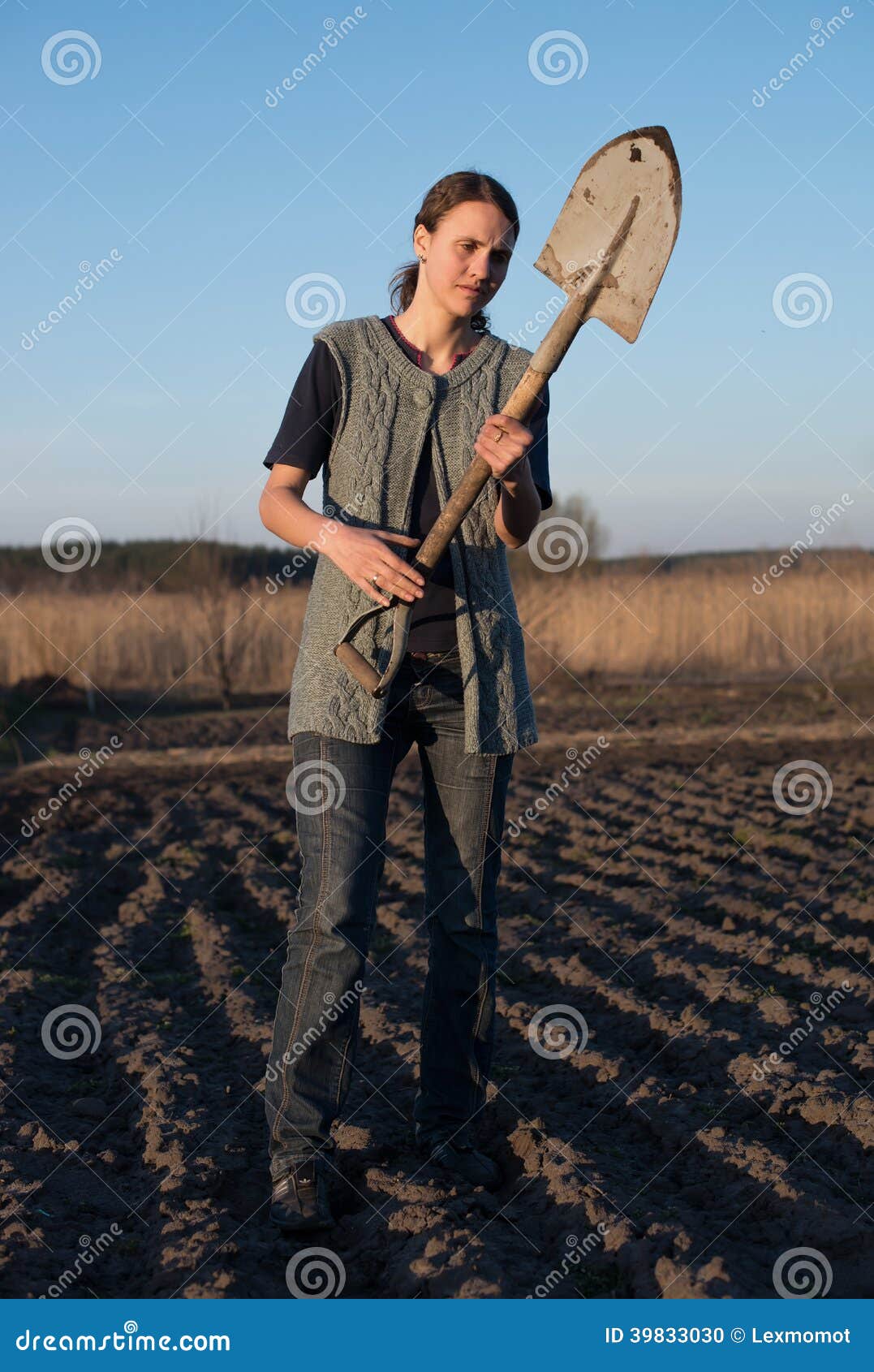 Female farmer with spade stock photo. Image of farmer - 39833030