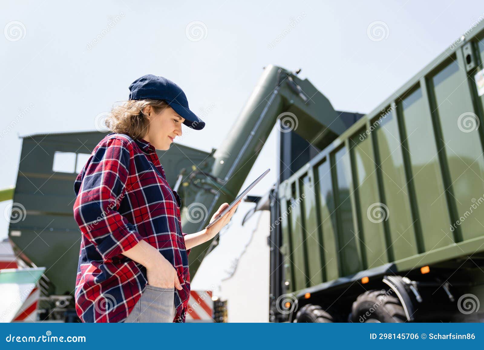 Female Farmer with Tablet is Watching Grain Loading Stock Photo - Image ...
