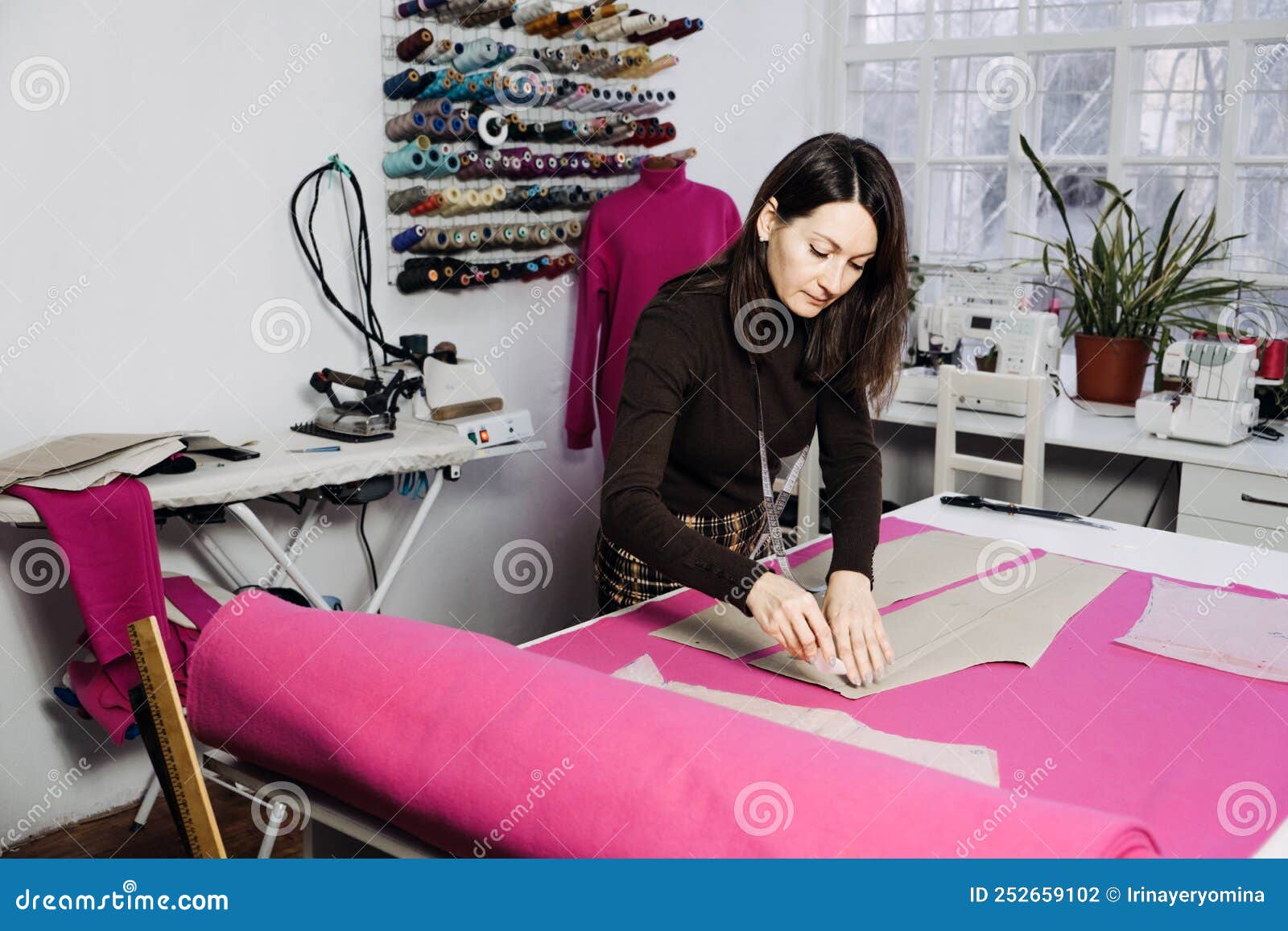 Female Fashion Designer Tailor Making Sewing Patterns at Workplace in ...