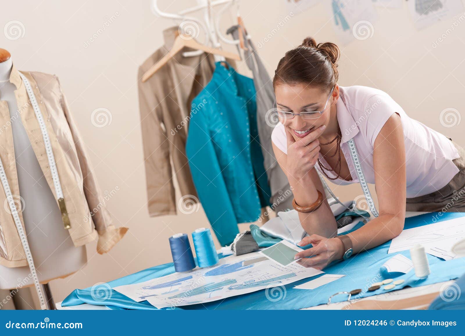 Female Fashion Designer Working at Studio Stock Photo - Image of button ...