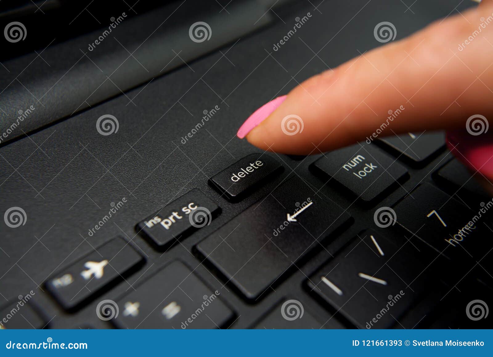 Female Finger Presses Delete Button on Black Laptop Stock Image - Image ...