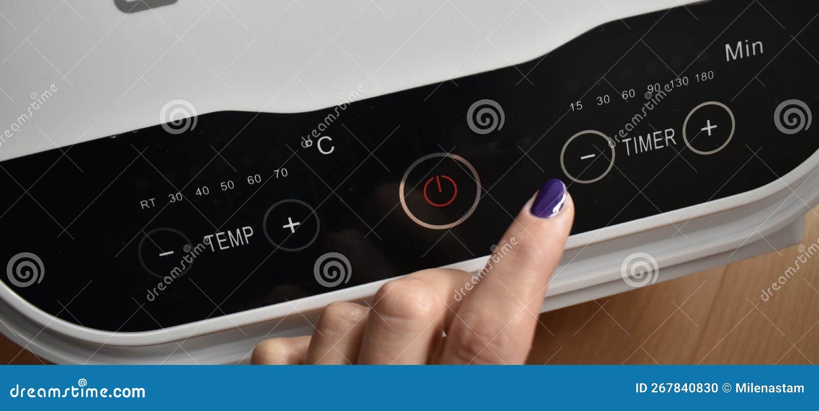 Female Fingers Choosing the Timer and Temperature on a Device Stock ...