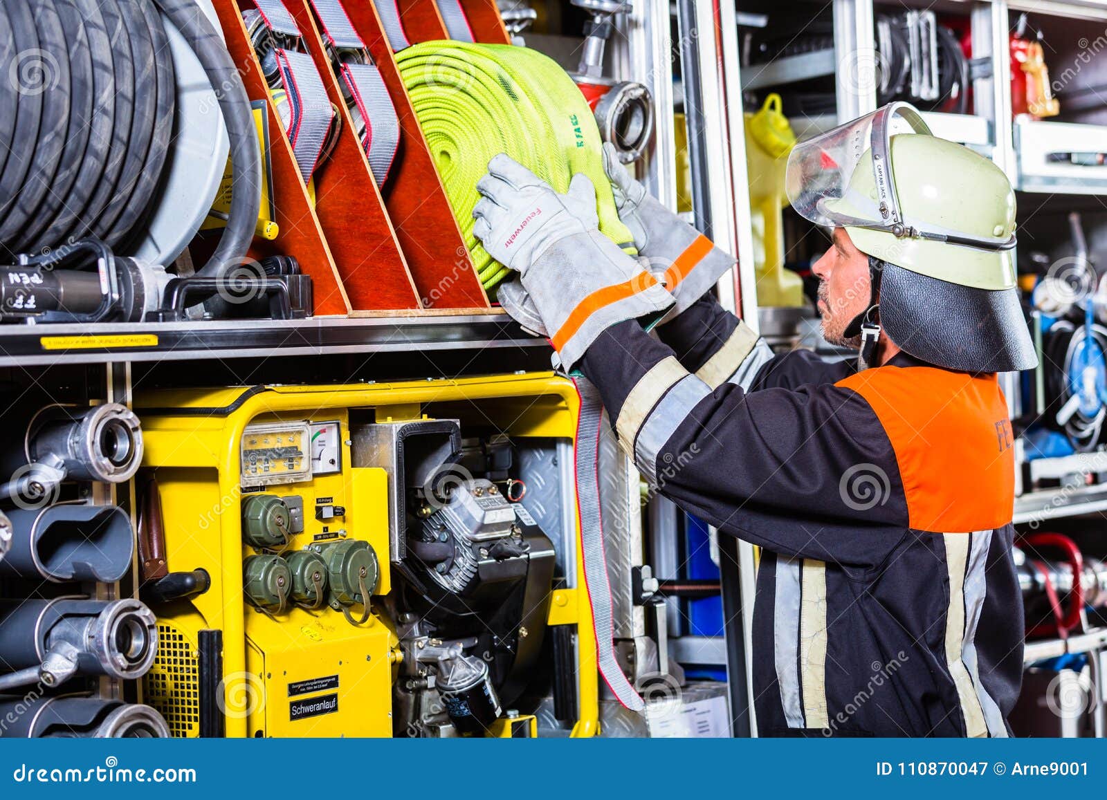 Fire Fighters Loading Hoses into Operations Vehicle Stock Image - Image ...