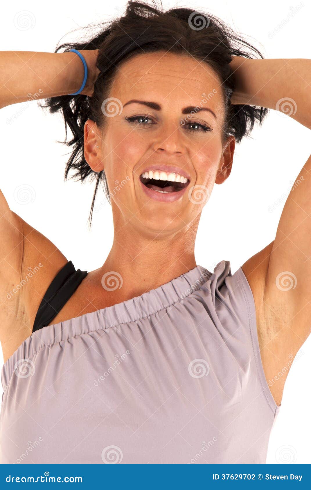 Female Fitness Model Smiling Pulling Her Hair Back Stock Photo - Image ...