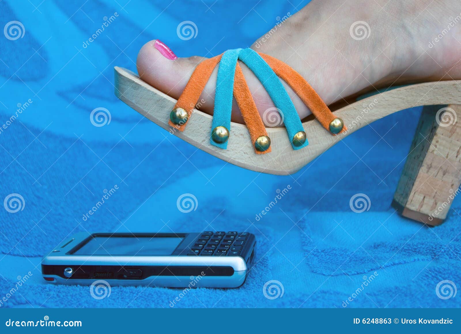 Female Foot in Sandal Above Cellphone Stock Image - Image of fashion ...