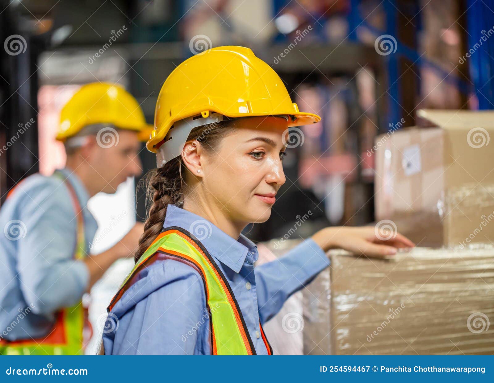 Female Foreperson Making Plans with Warehousemen, Manager and ...