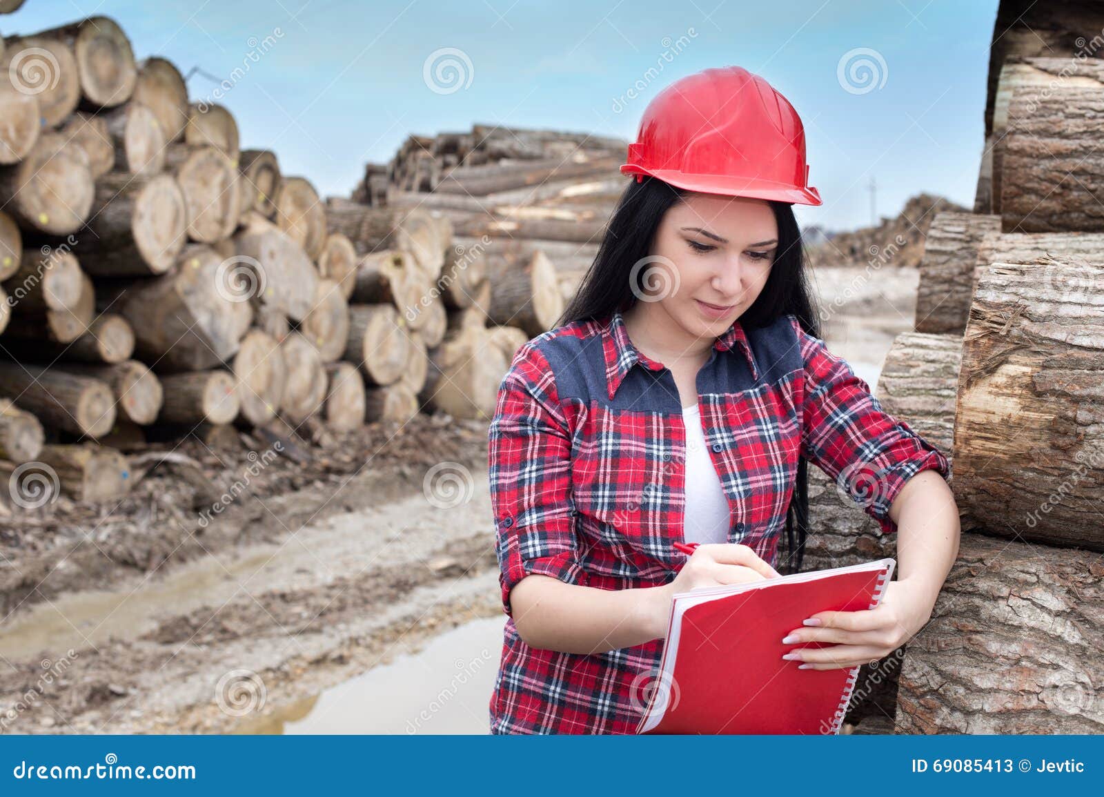 Female Forest Engineer beside Logs Stock Image - Image of forestry ...