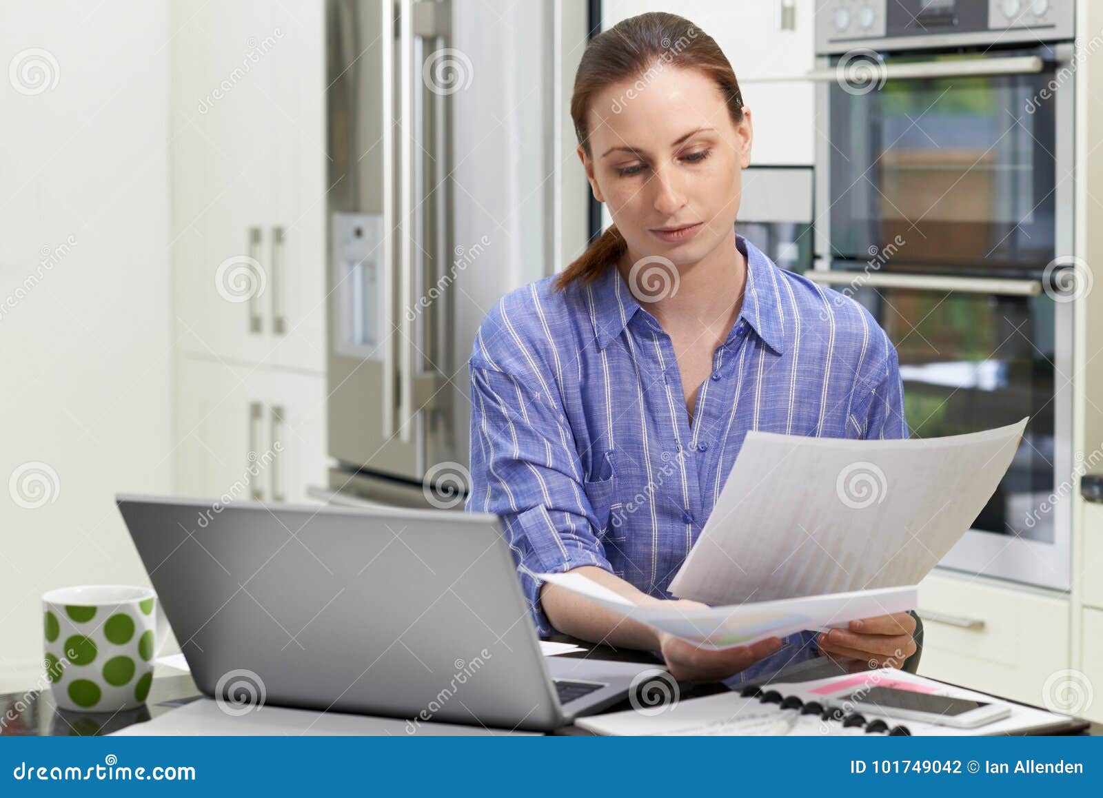 Female Freelance Worker Using Laptop in Kitchen at Home Stock Photo ...