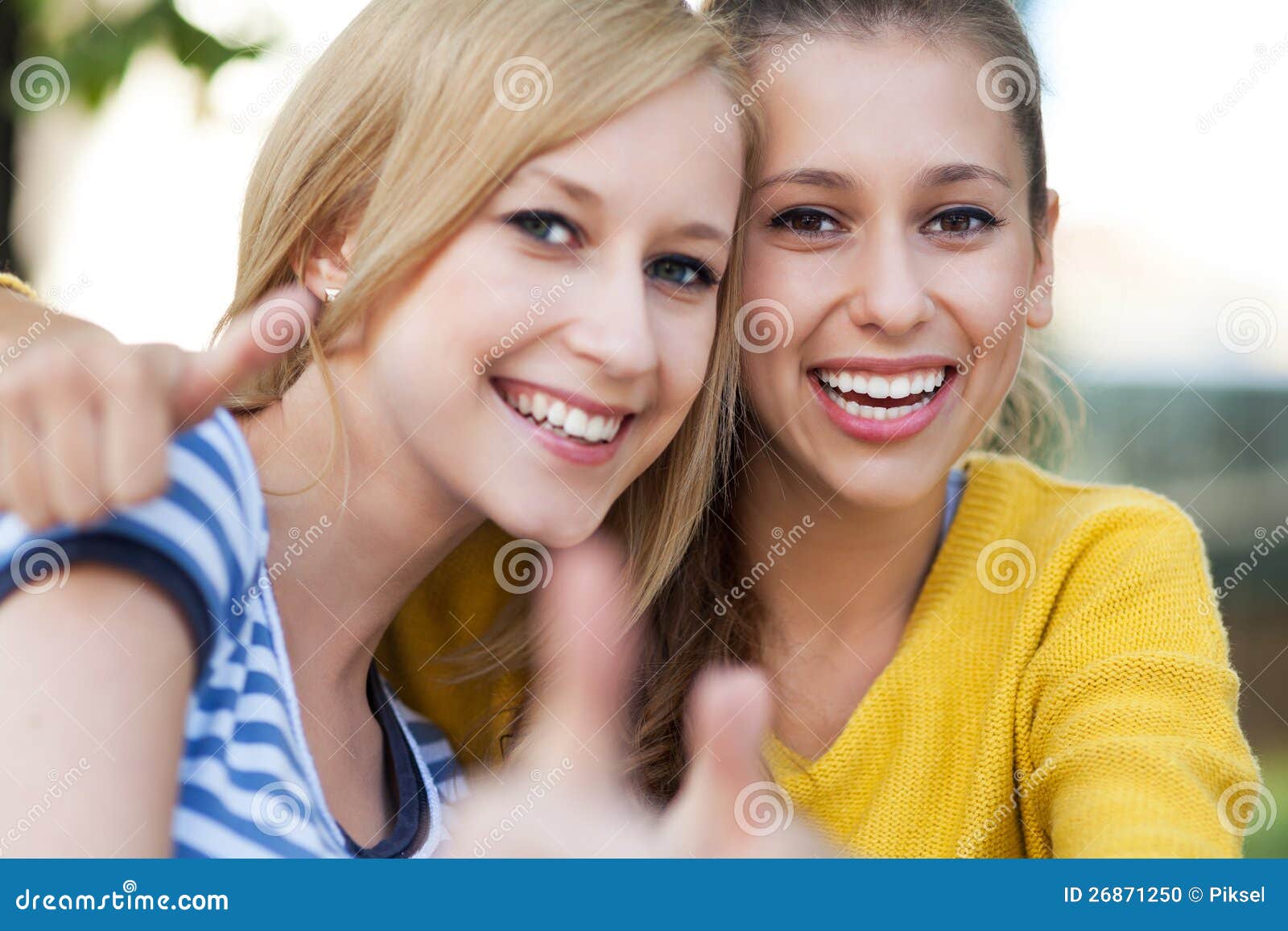 Female friends stock photo. Image of teenagers, thumbs - 26871250
