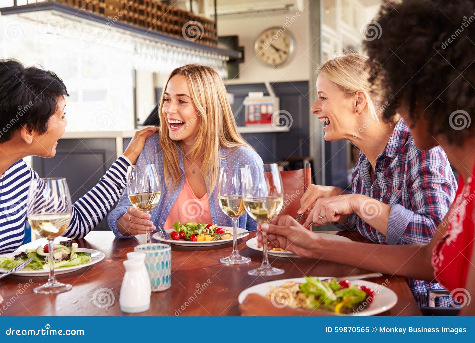 Female Friends Eating at a Restaurant Stock Image - Image of four ...