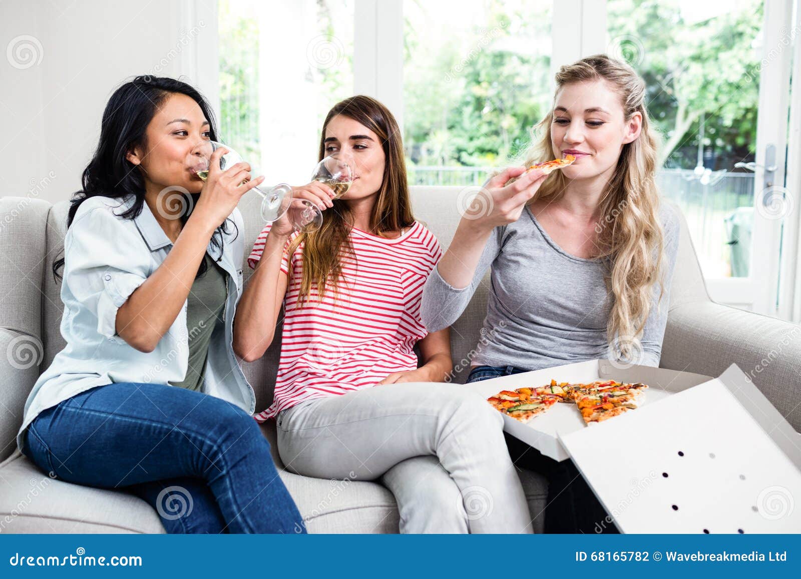 Female Friends Having Snacks and Drinks at Home Stock Photo - Image of ...