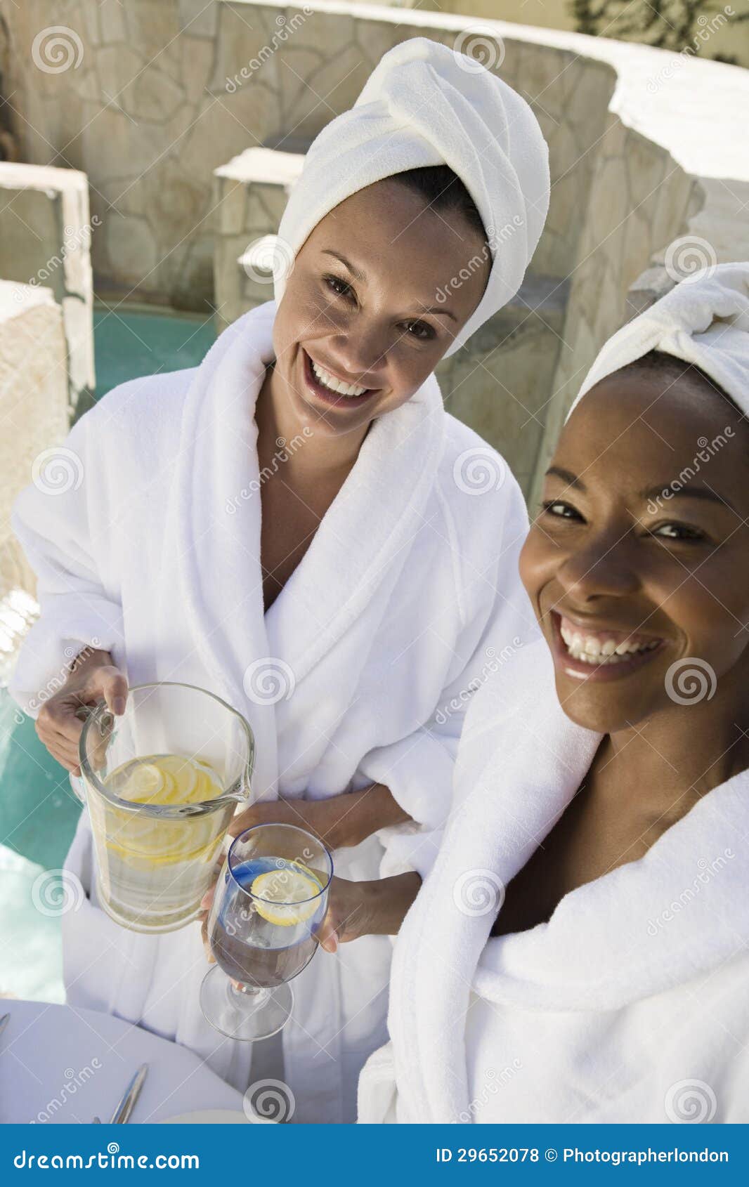 Female Friends Holding Pitcher and Glass Stock Photo - Image of aged ...