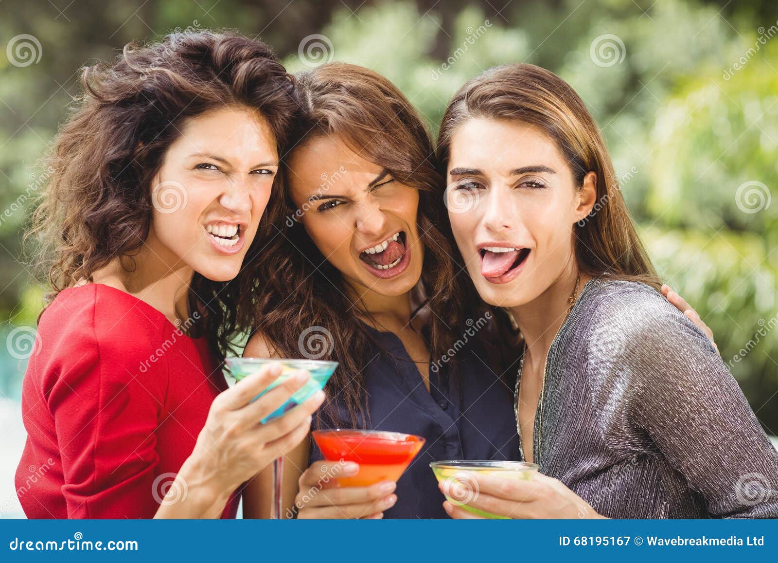 Female Friends Making Face while Drinking Cocktail Stock Image - Image ...