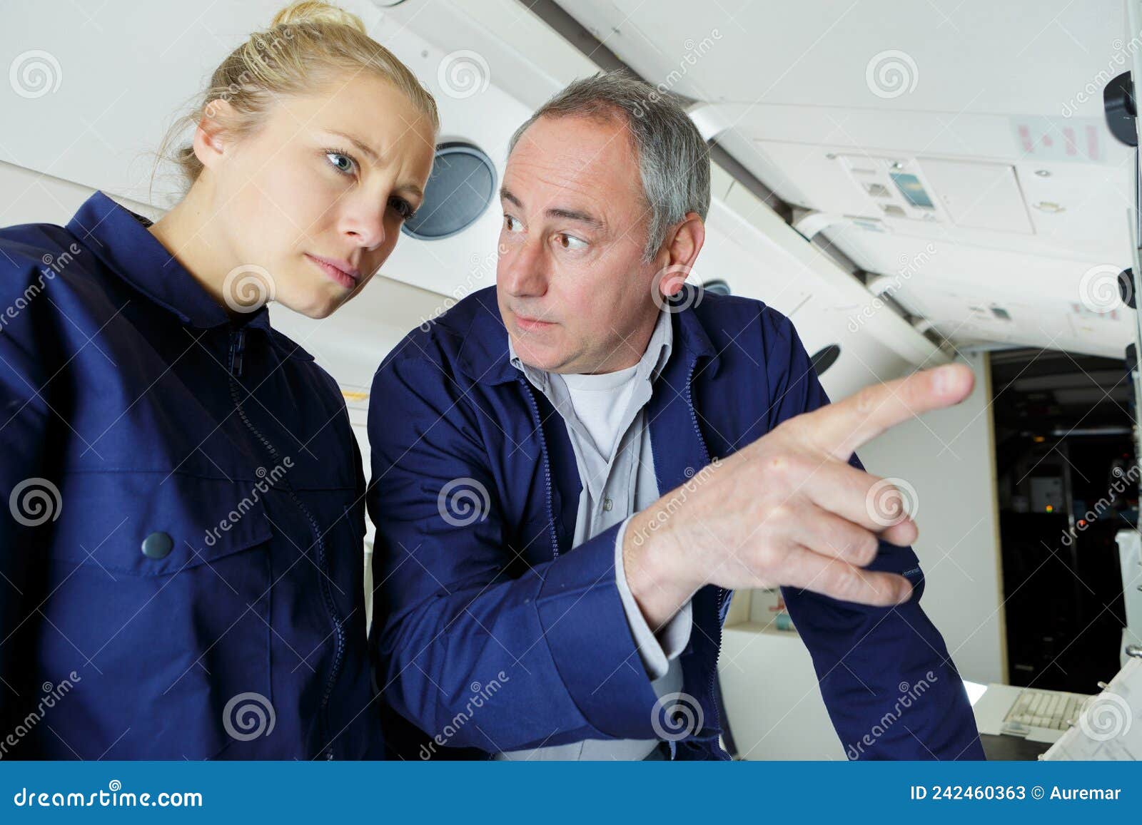 Aircraft Engineer Watching His Teenager Brother Fixing Airplane Motor ...