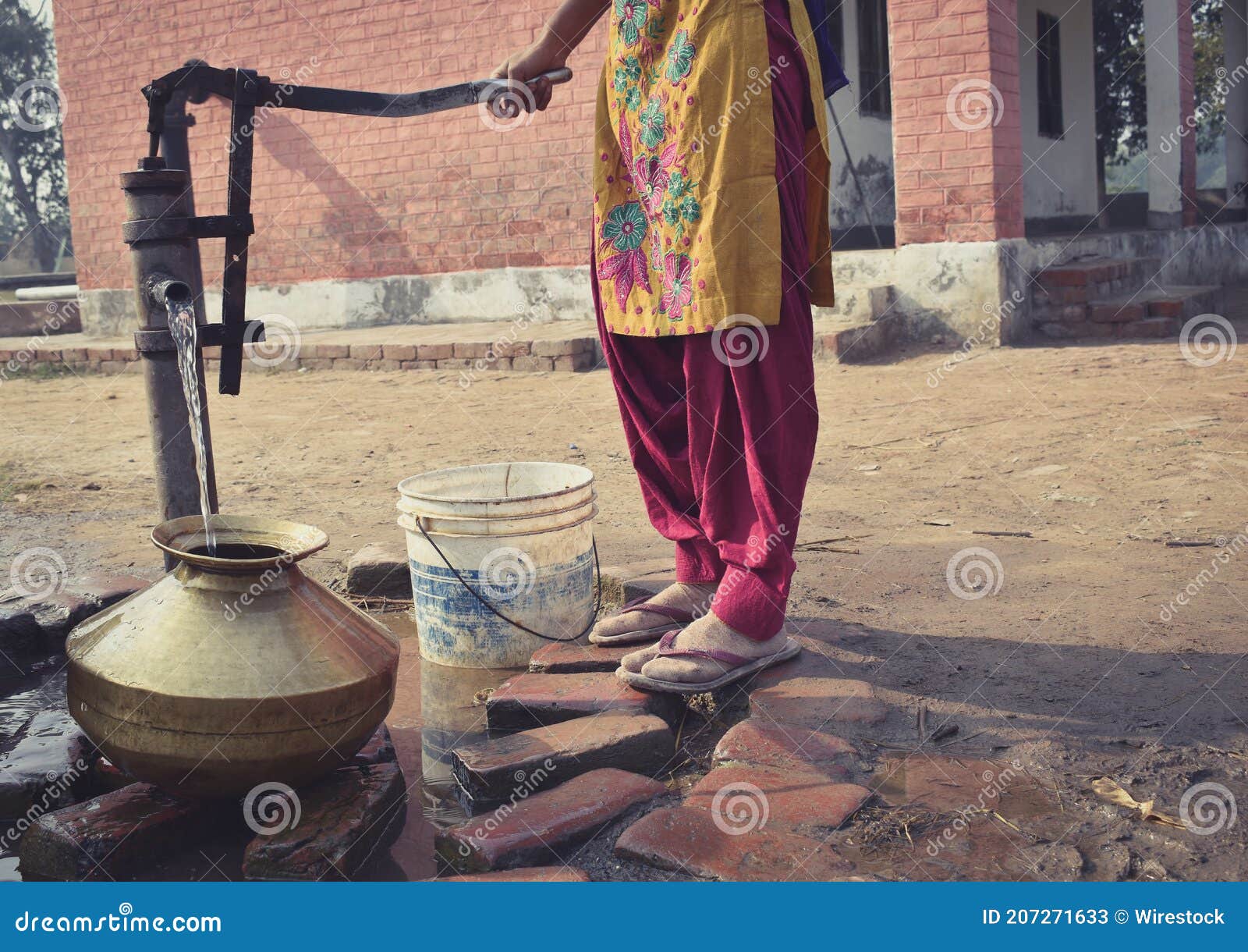 Female Gathering Water from a Water Supply Stock Image - Image of clear ...