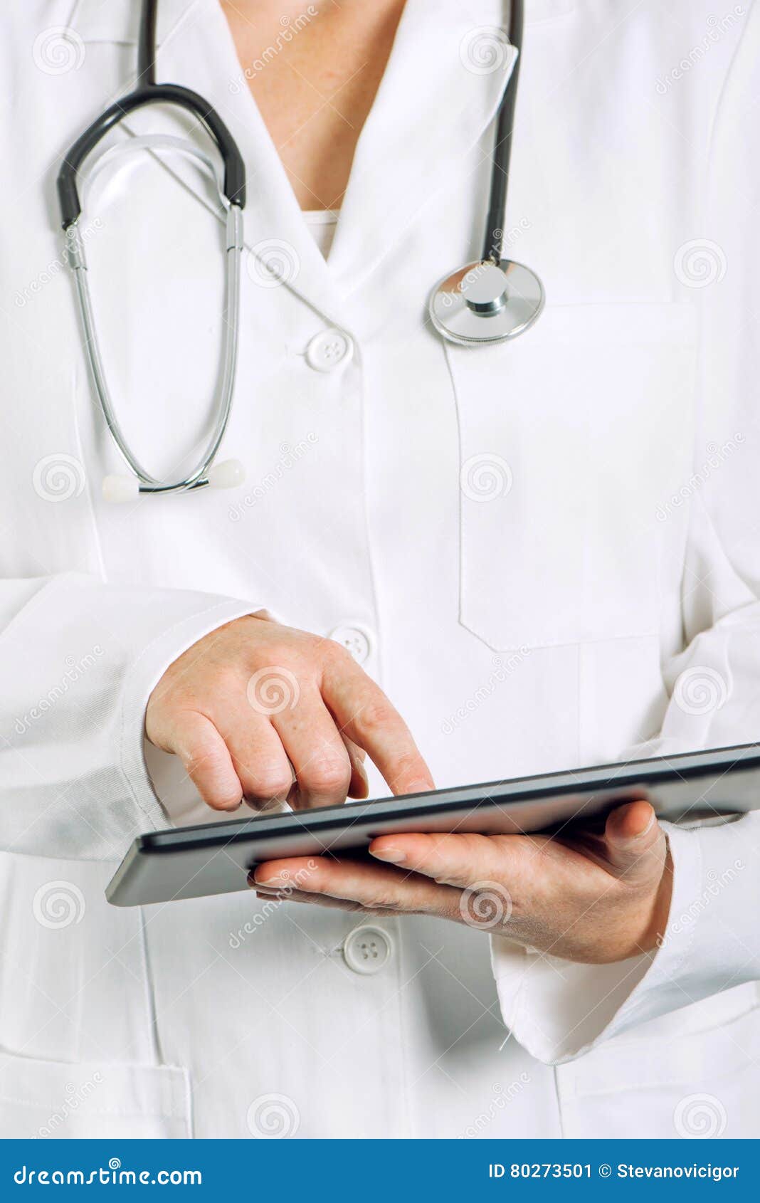 Female General Medical Practitioner Using Tablet Computer Stock Image ...
