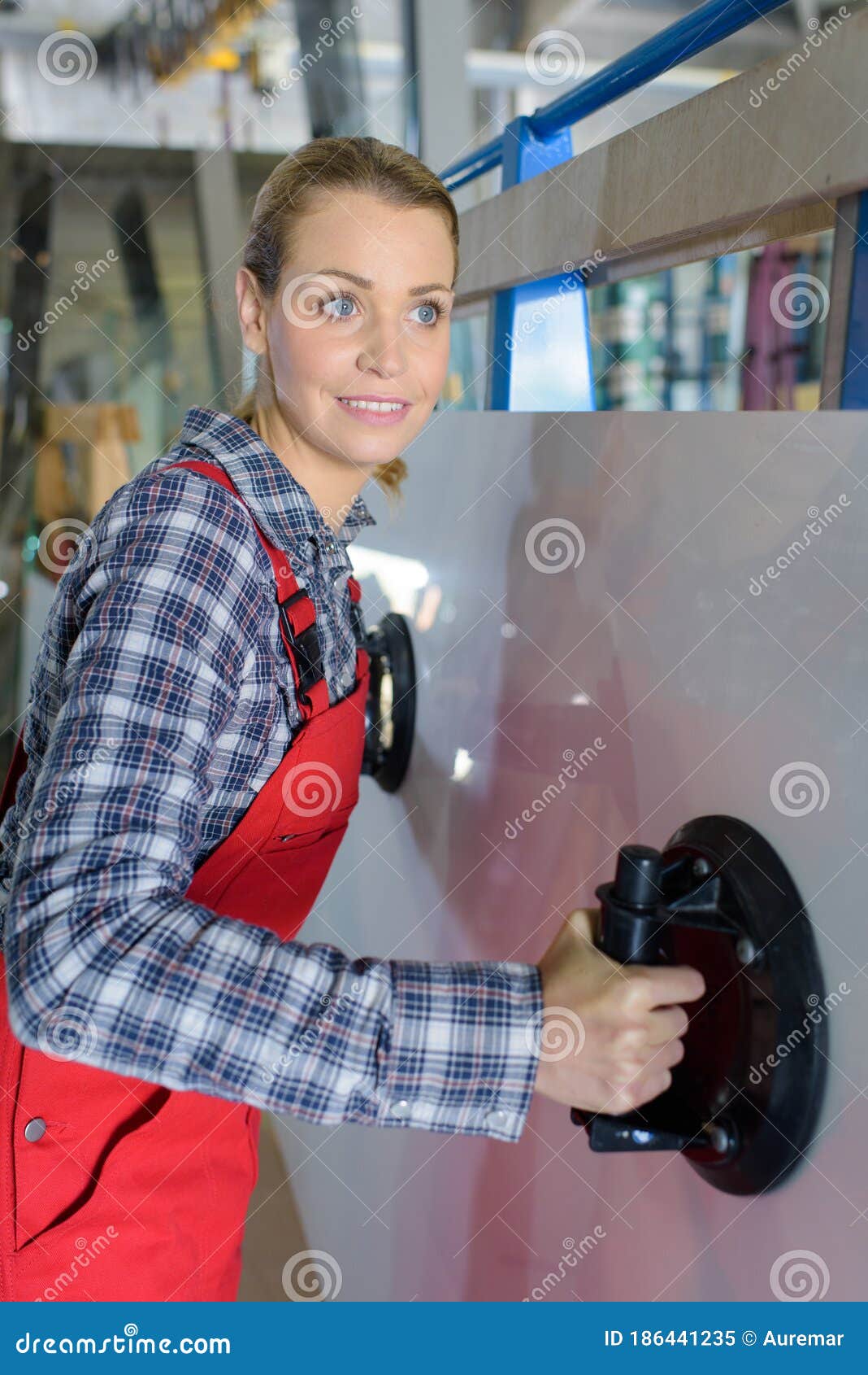 Female glazier at work stock image. Image of worker - 186441235