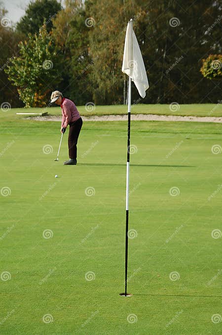 Female golfer putting stock image. Image of compete, blue - 6735811