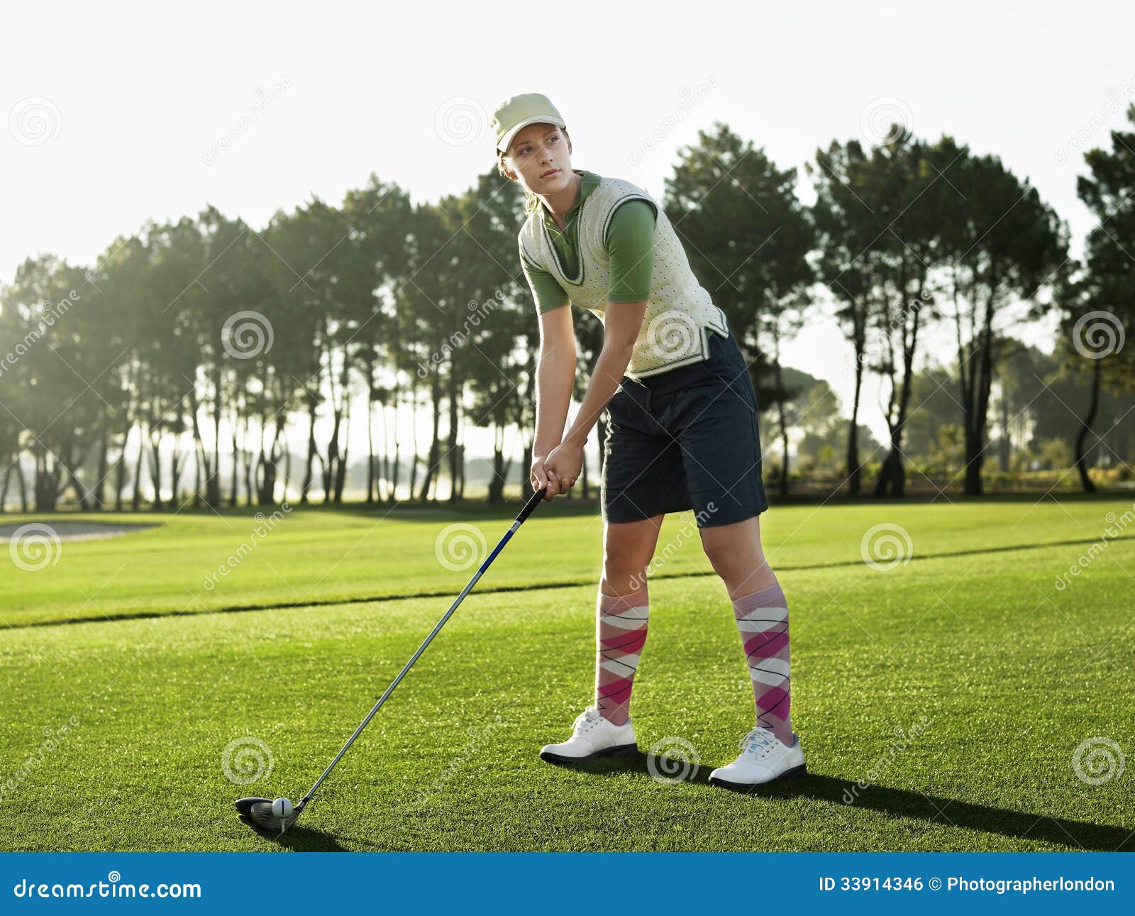 Female Golfer Teeing Off on Golf Course Stock Photo - Image of golfclub ...