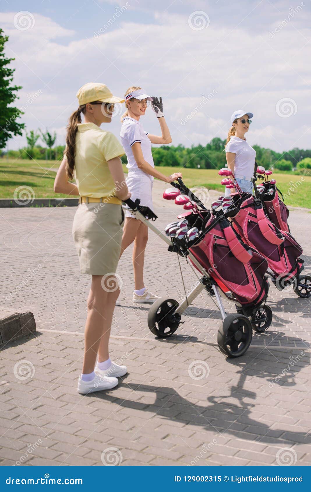 Female Golfers with Golf Equipment Walking Stock Image - Image of ...